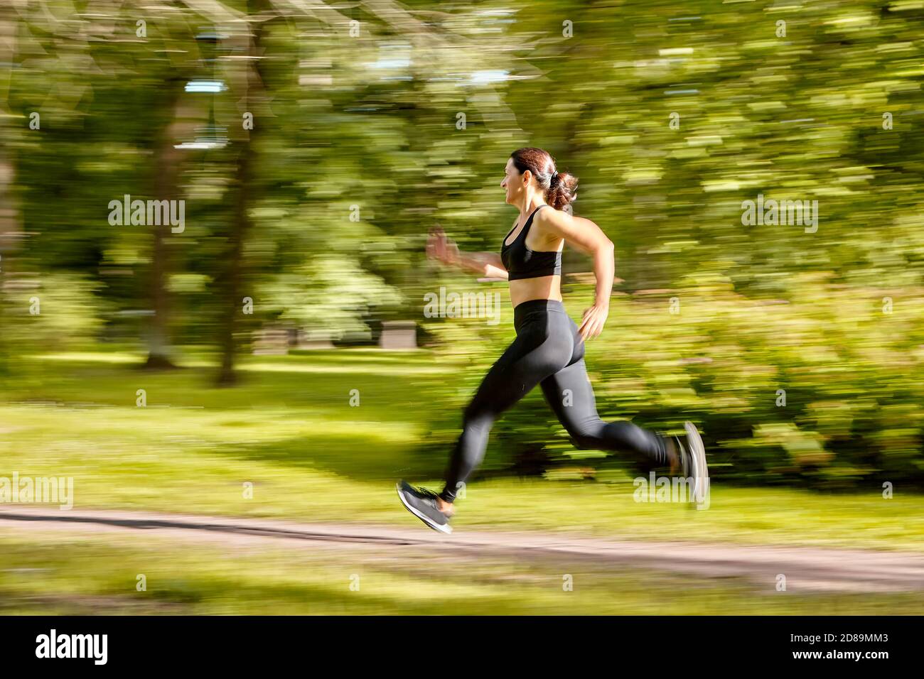 Female runner in blurred motion hi-res stock photography and images - Alamy