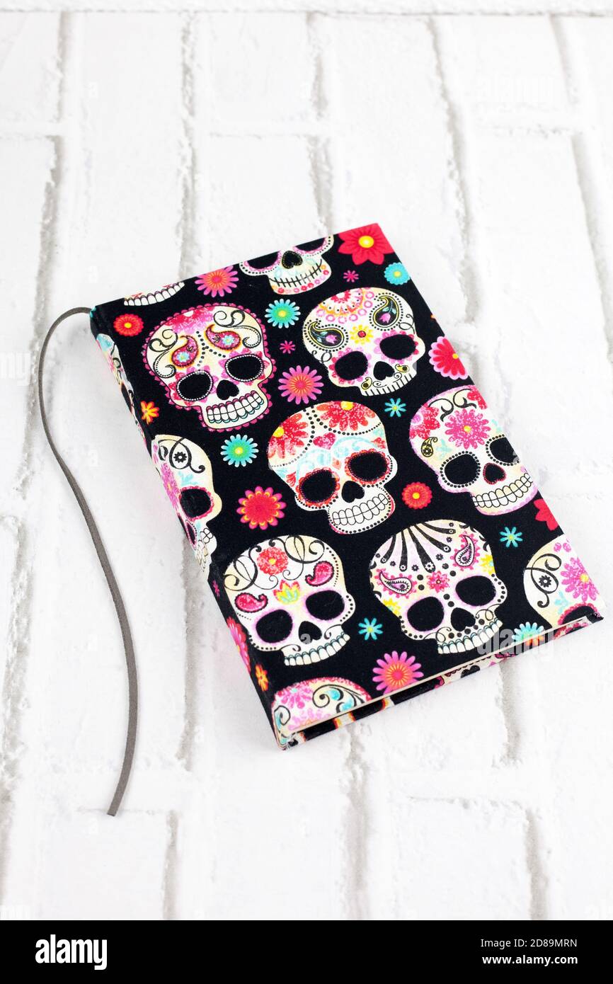 Handmade notebook with skulls fabric cover Stock Photo - Alamy