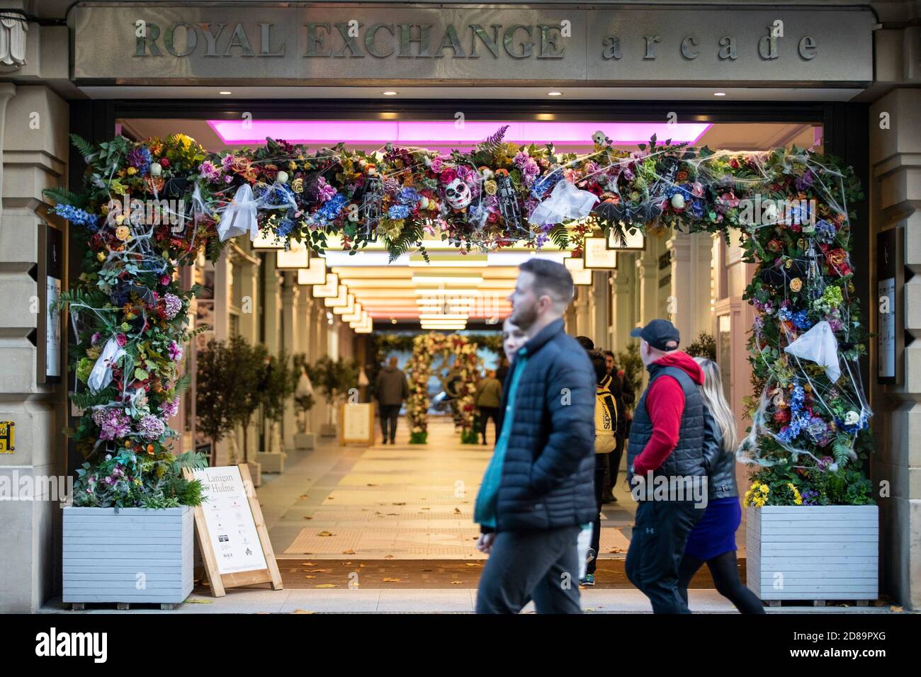 Shoppers walk past the Royal Exchange shopping arcade in Manchester ...