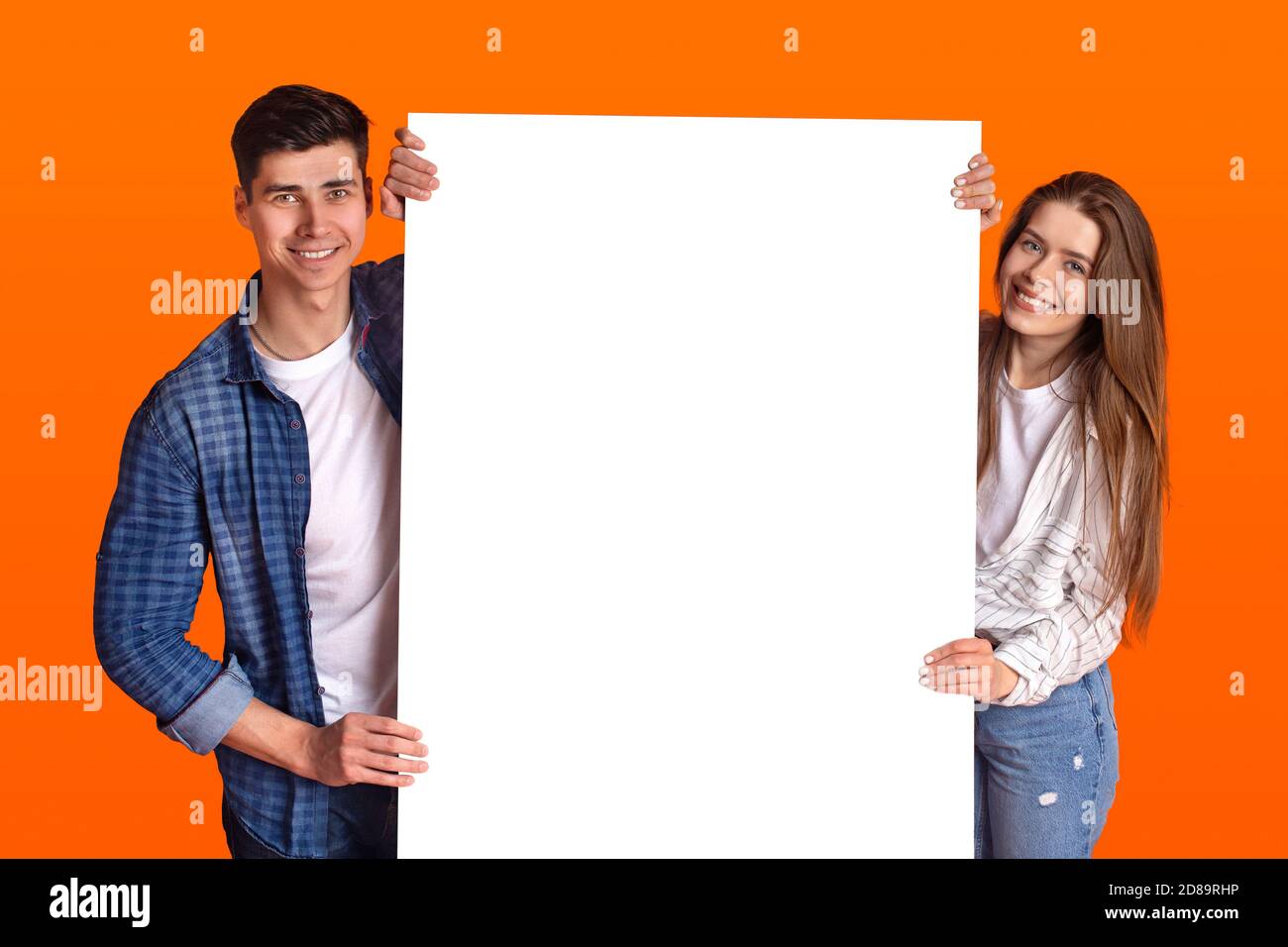 Great offer and advertising space from couple in love Stock Photo - Alamy