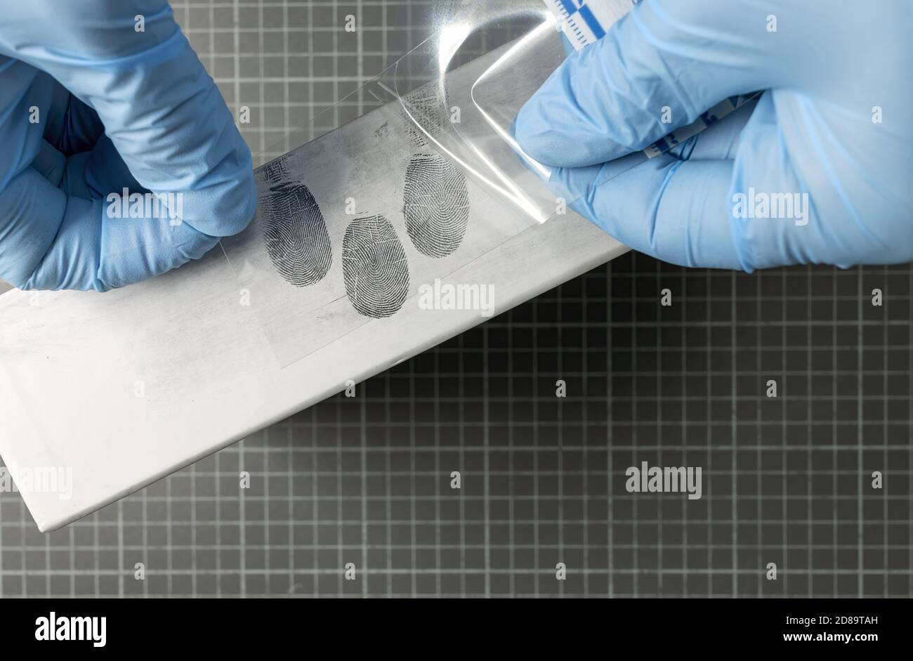 View of police using fingerprint instant lifters for catching the ...