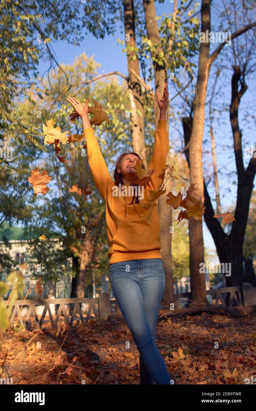 Beautiful caucasian young woman walking and having fun outdoors in ...