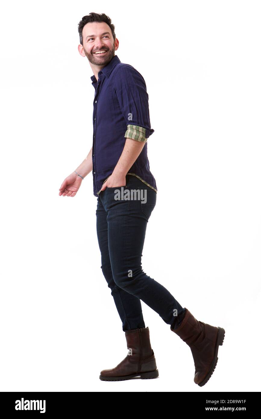 Full body side portrait of happy man walking against isolated white ...