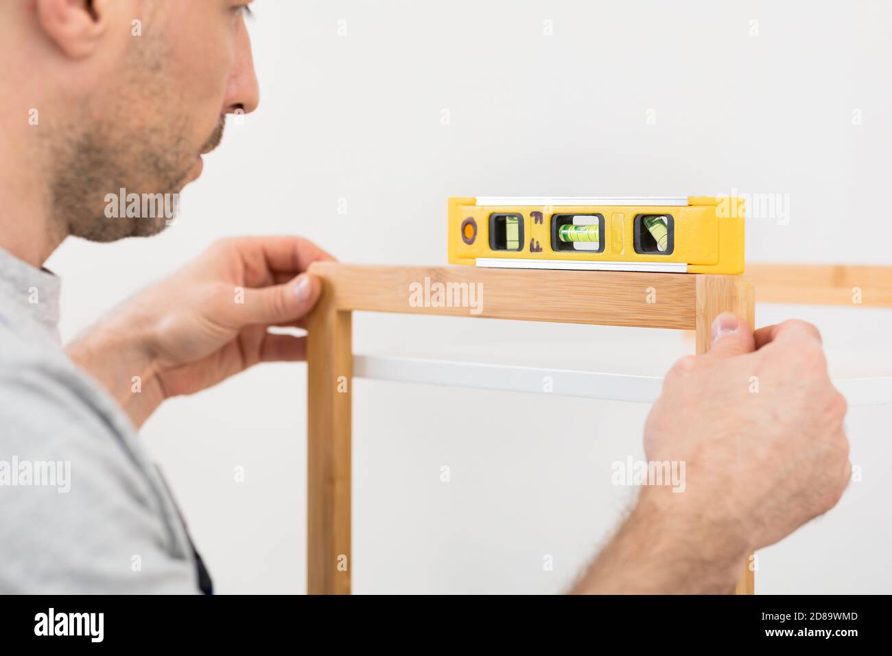 Unrecognizable Man Using Level Tool Making Wooden Shelf Indoors ...