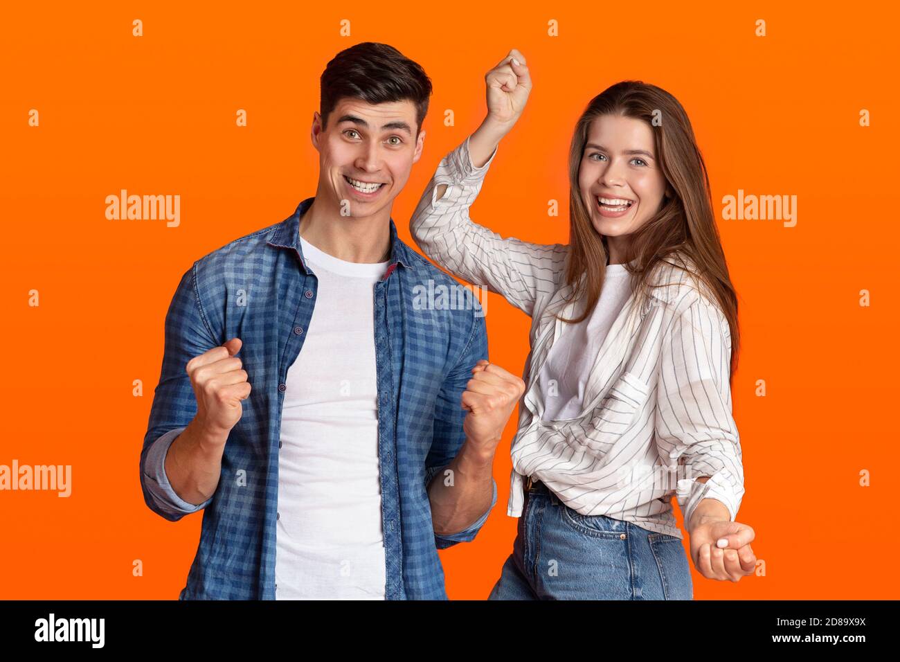 Happy young couple of students in love in casual express emotions of ...