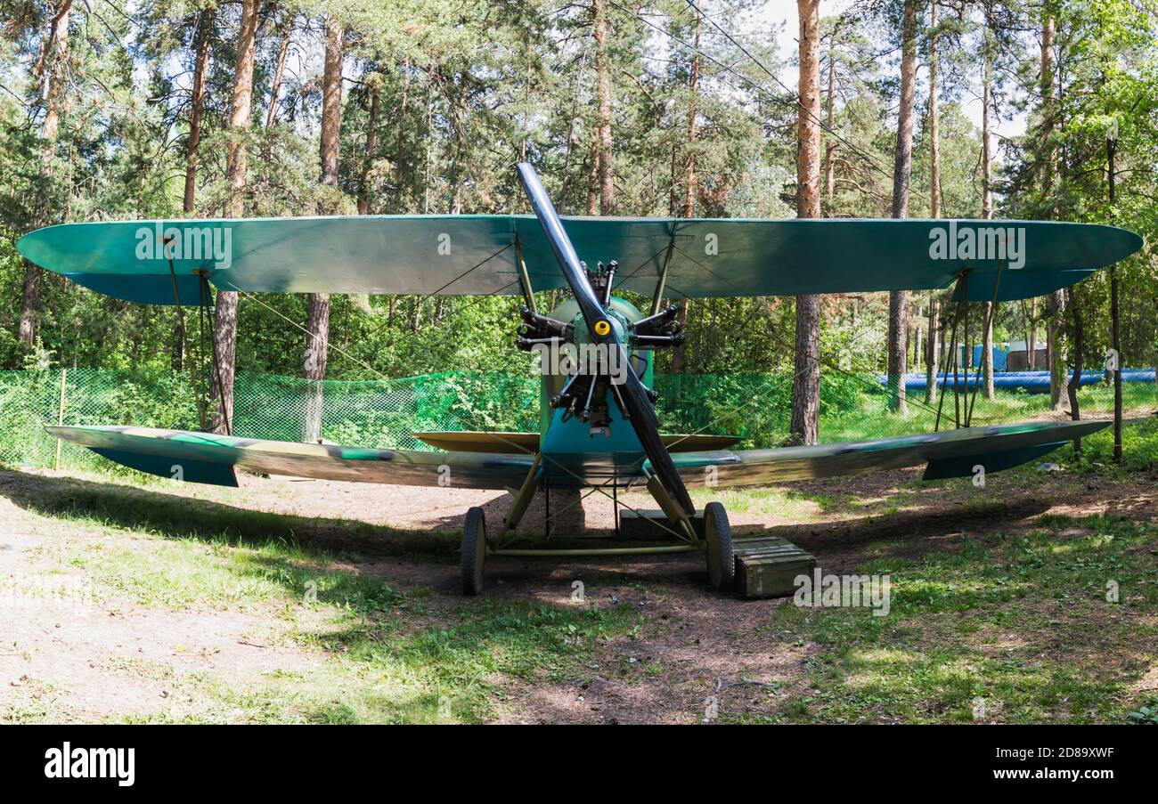 Old vintage biplane on a forest airfield Stock Photo - Alamy