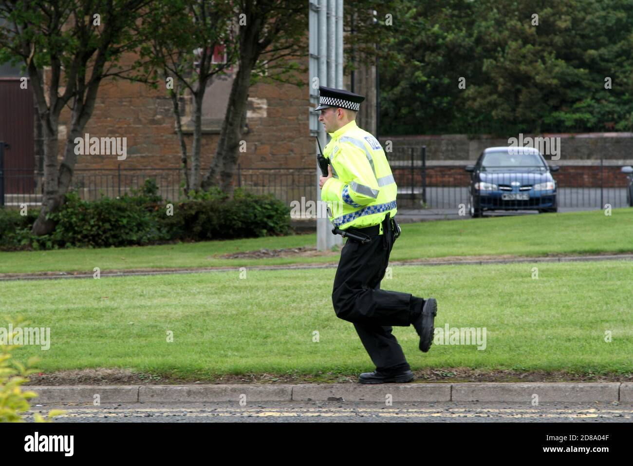 A Scottish Police officer ruuning in full uniform Stock Photo - Alamy