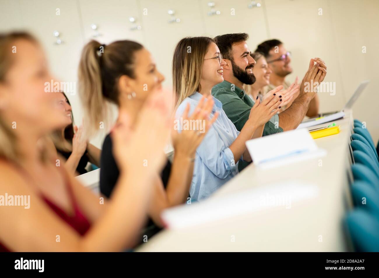 Students clapping in classroom hi-res stock photography and images - Alamy