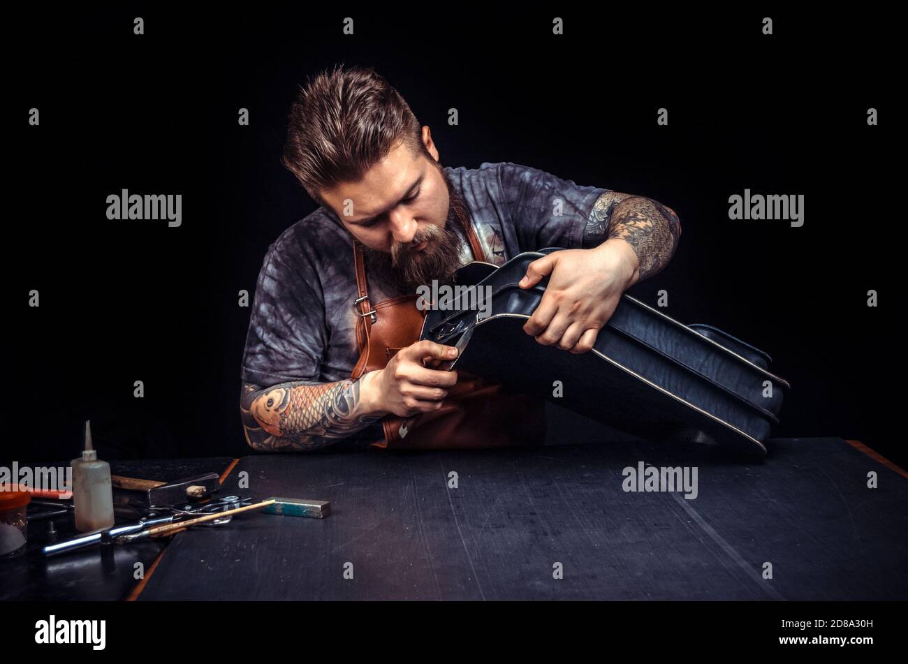 Professional Tanner working as artisan at his leather studio Stock ...