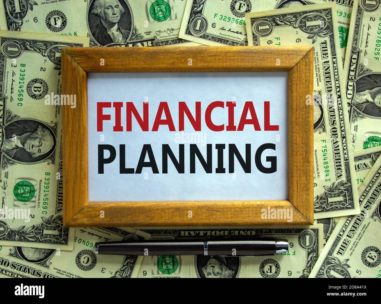 Wooden picture frame with inscription 'financial planning' on beautiful ...