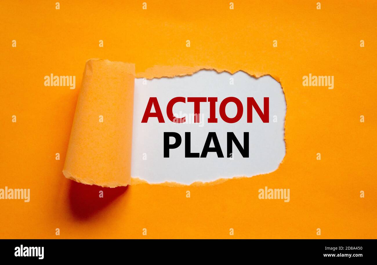 Words 'action plan' appearing behind torn orange paper. Business ...