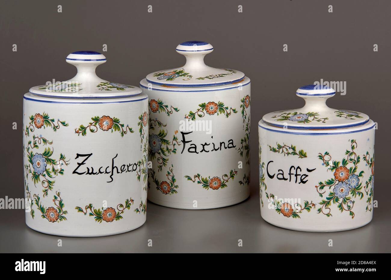 a coffee pot,a sugar pot and a flour pot in decorated ceramic Stock ...