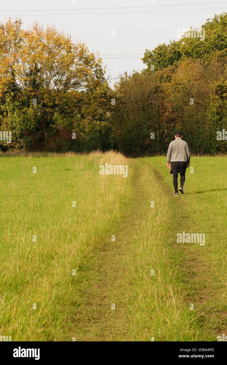 Man alone in field in hi-res stock photography and images - Alamy