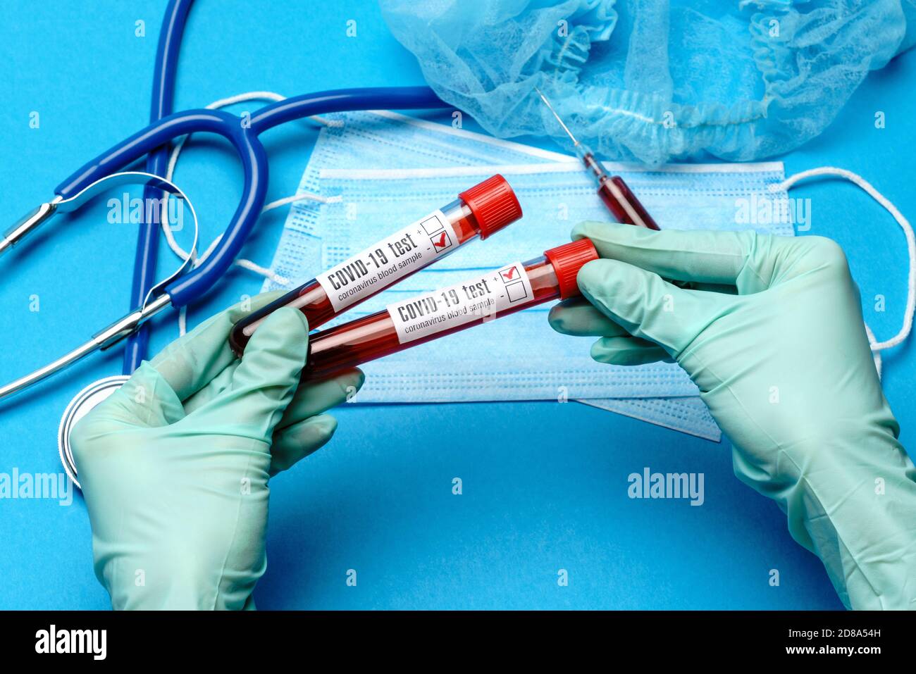 lab technician assistant or doctor holding a blood sample in test tube ...