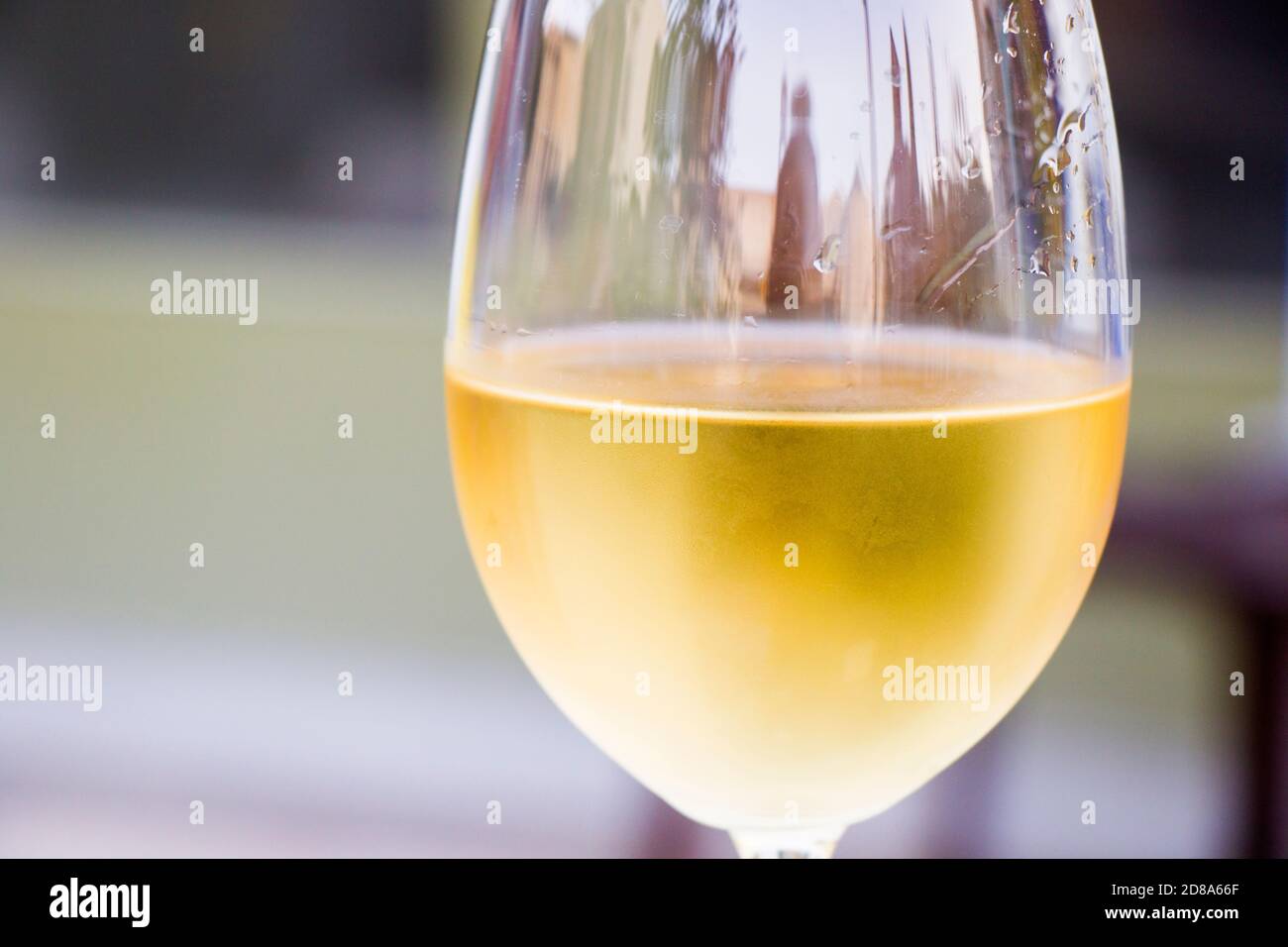 White wine in wineglass close-up background, yellow color Stock Photo ...