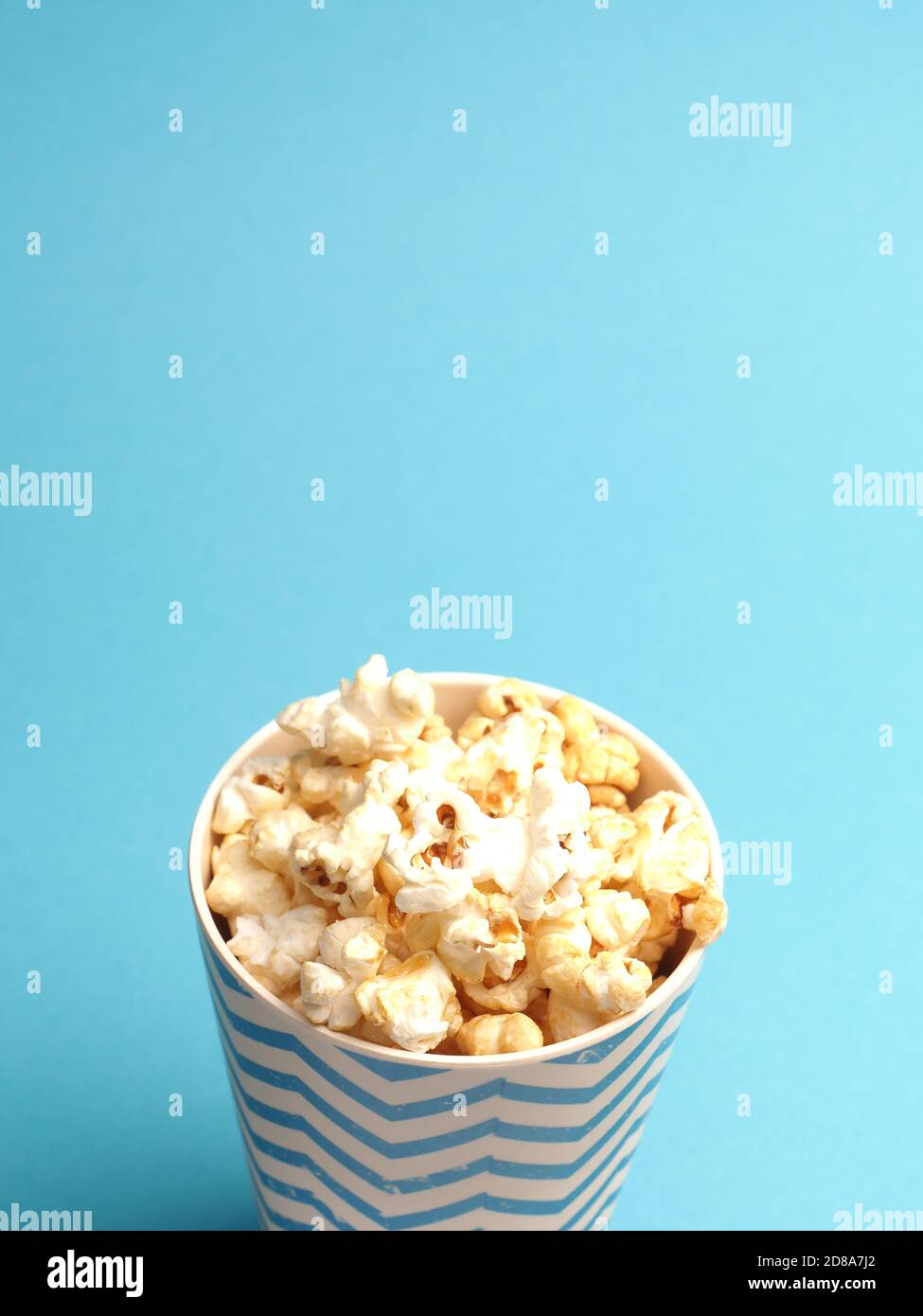 Fresh popcorn on a blue background with space for your text Stock Photo ...