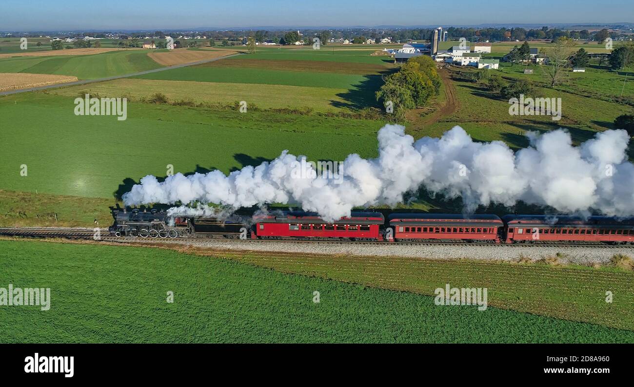 Aerial View of Steam Passenger Train Puffing Smoke Traveling in Amish ...
