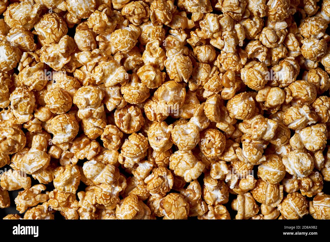 Lots of popcorn with sweet caramel close-up for movies Stock Photo - Alamy