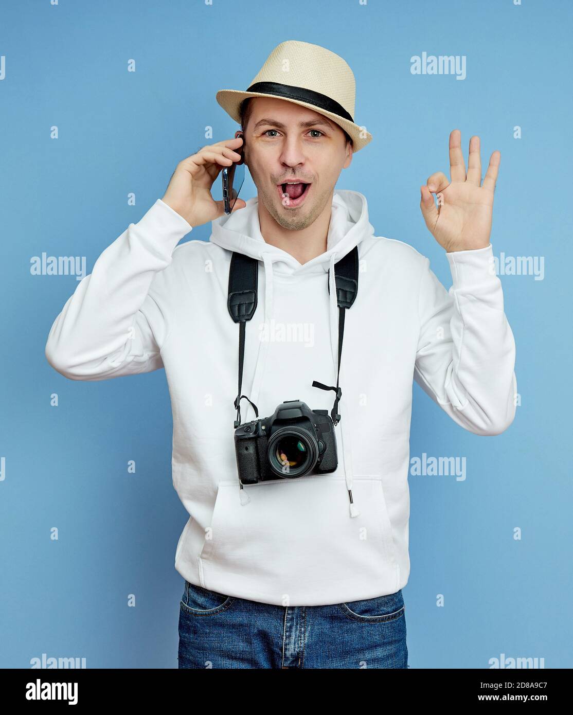 Man with a camera is happy, good luck and victory, euphoria Stock Photo ...