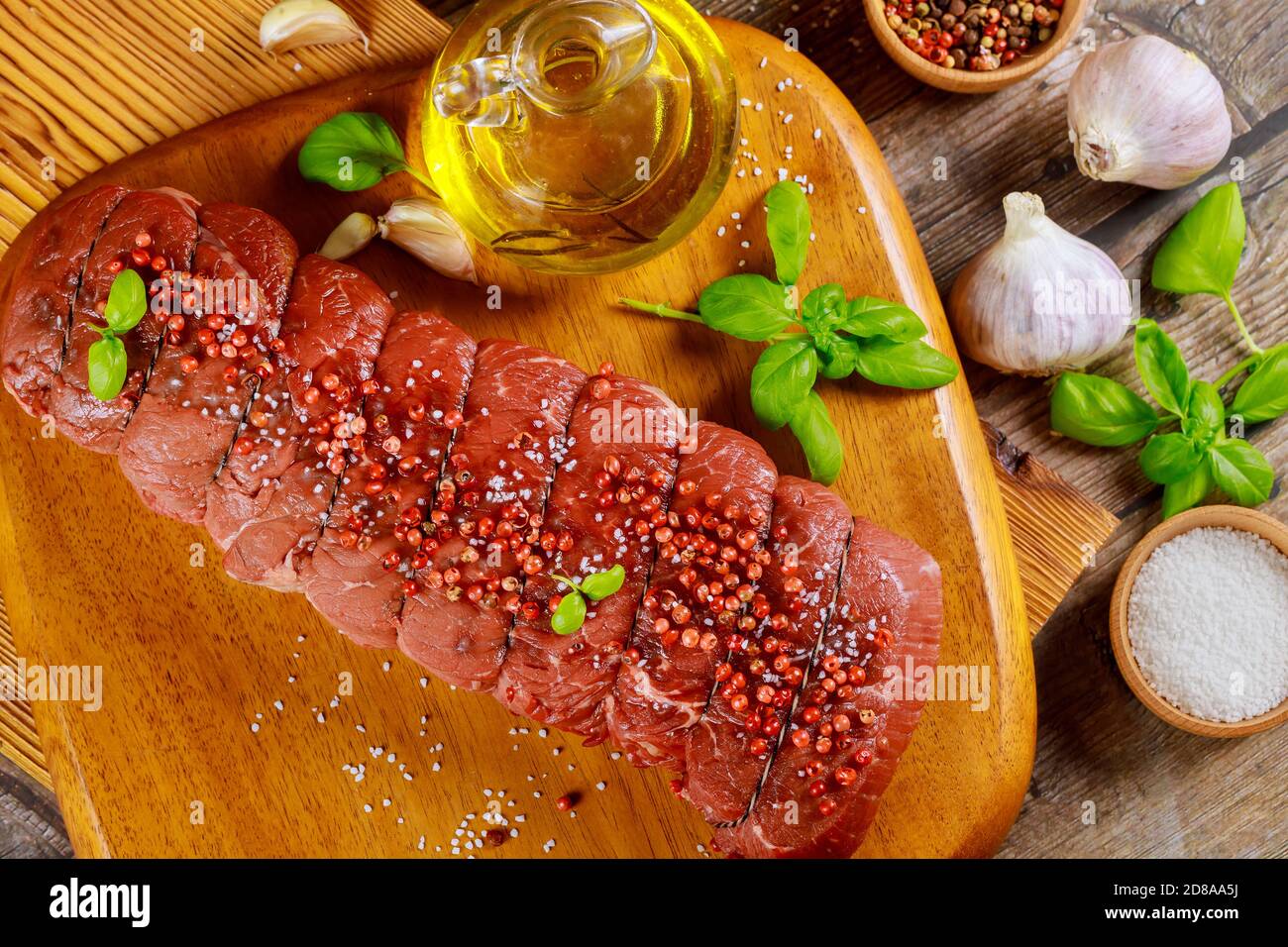 Preparation raw beef meat for grilling with spices Stock Photo - Alamy
