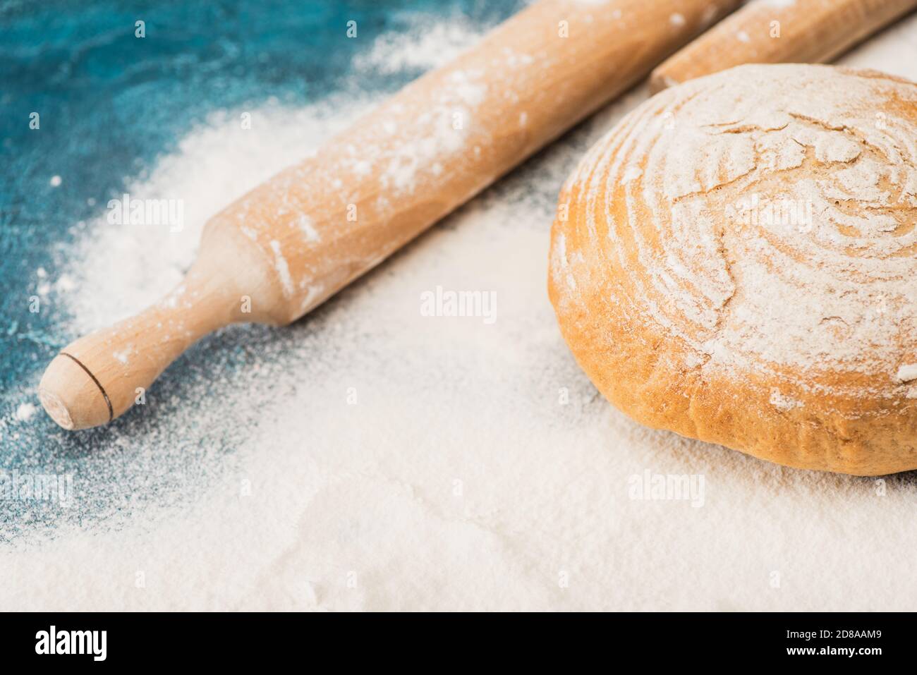 fresh baked bread and wooden rolling pin on flour Stock Photo - Alamy