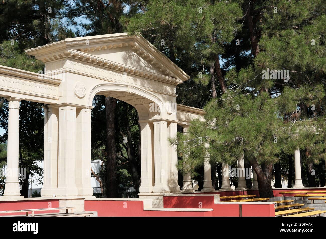 beautiful arch in ancient style in the forest park. a part of a scene ...