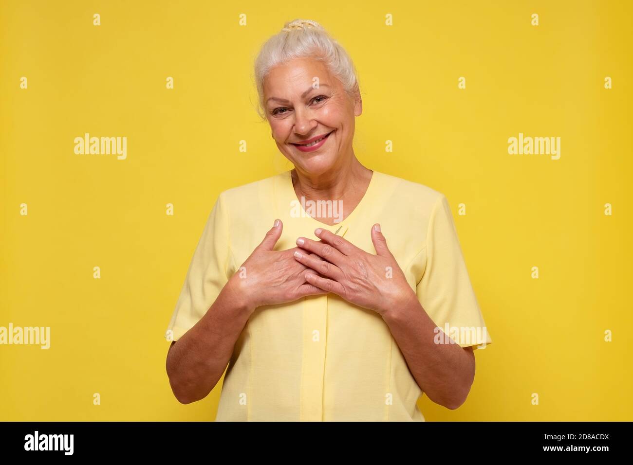 Caucasian senior laughing woman feeling pleased receiving a compliment ...