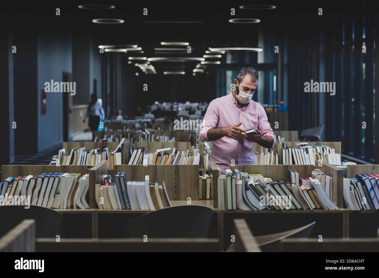 College student reading books in a library Stock Photo - Alamy