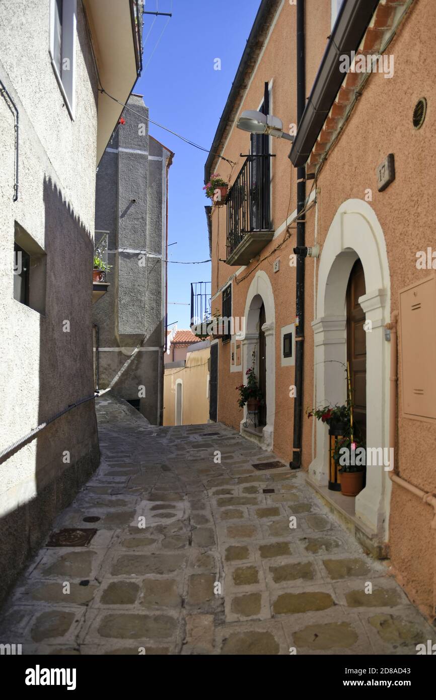A narrow street among the old houses of Viggiano, a medieval village in ...