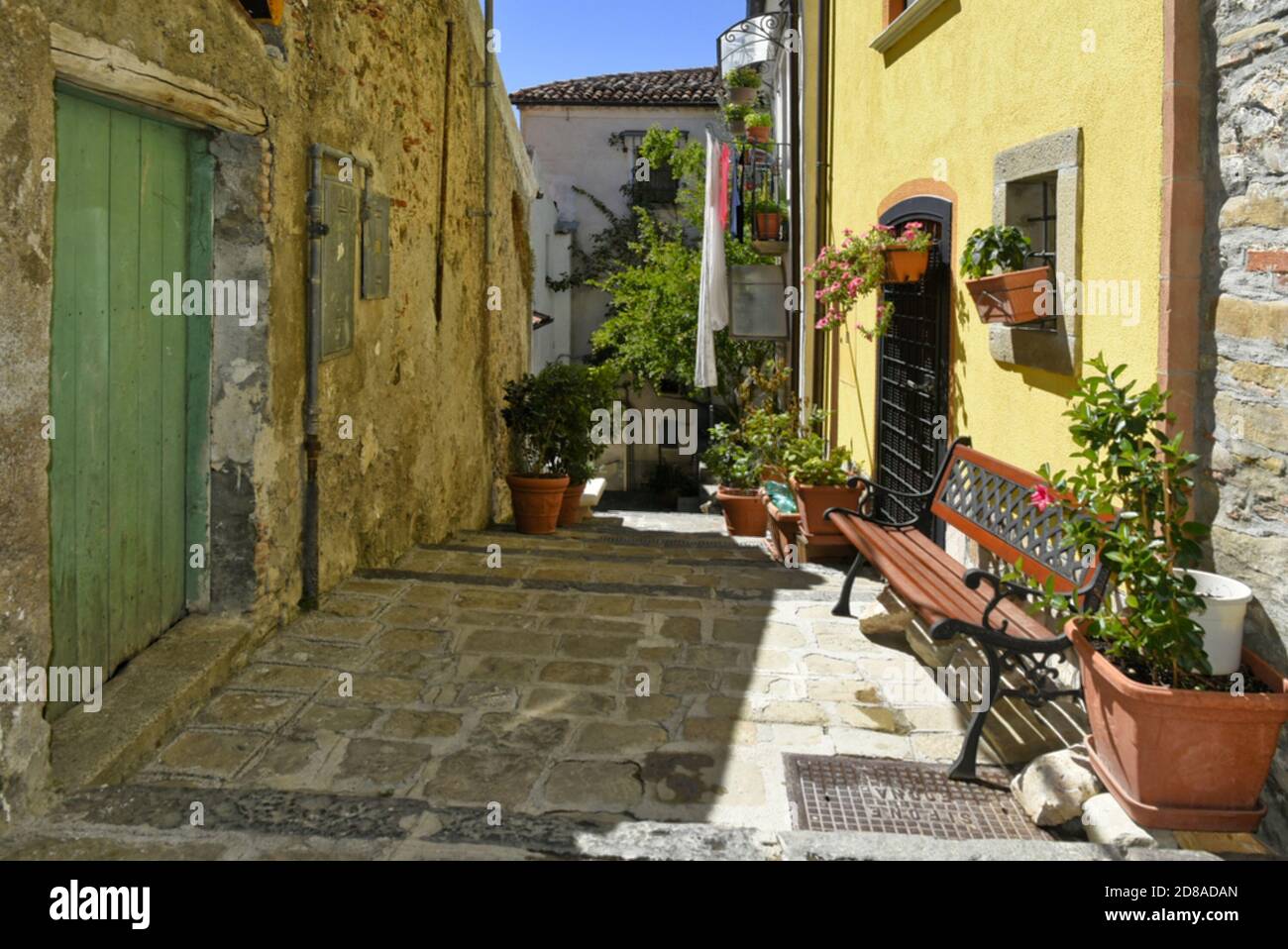 A narrow street among the old houses of Viggiano, a medieval village in ...