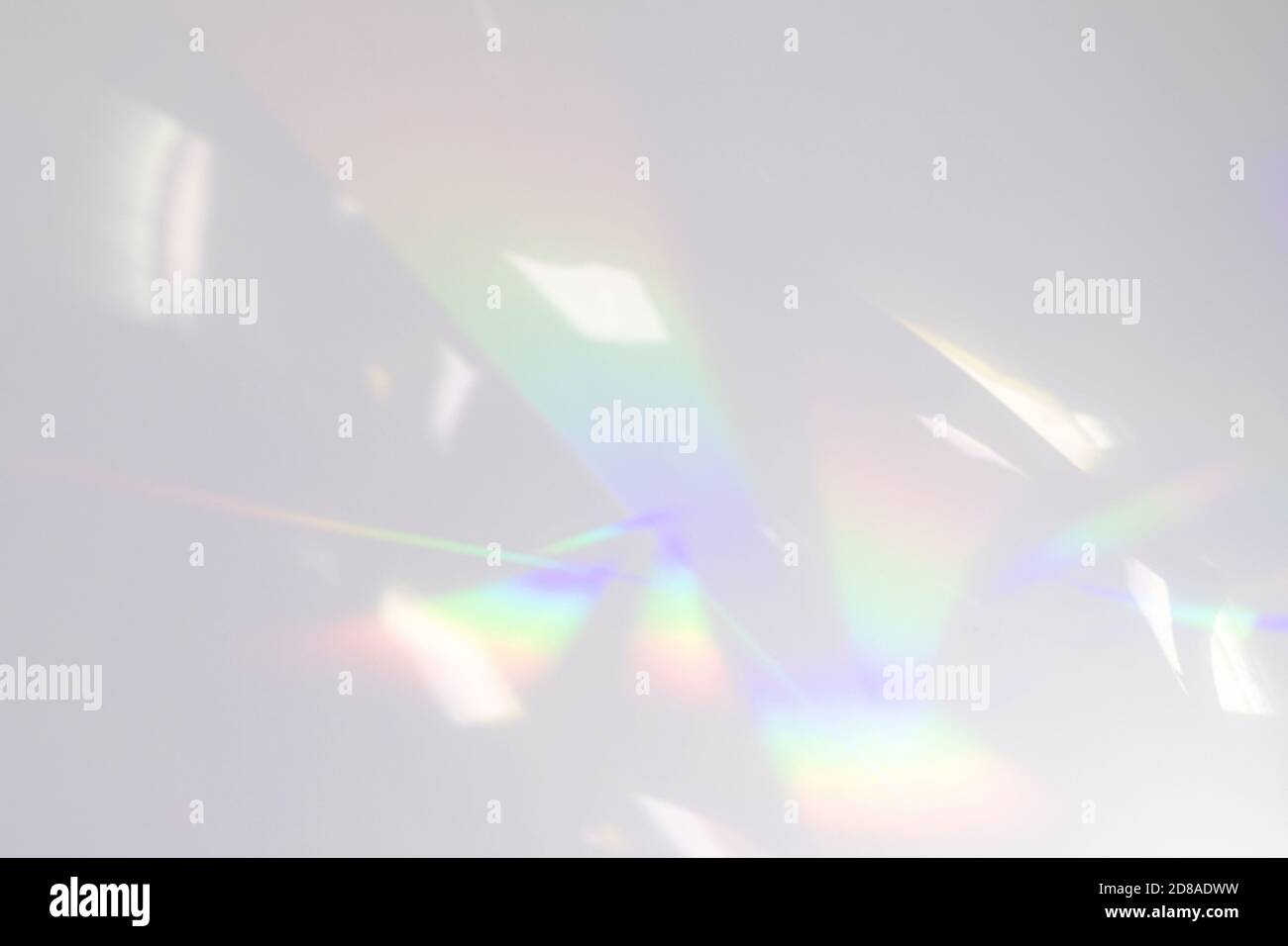 Blurred rainbow light refraction texture on white wall Stock Photo - Alamy