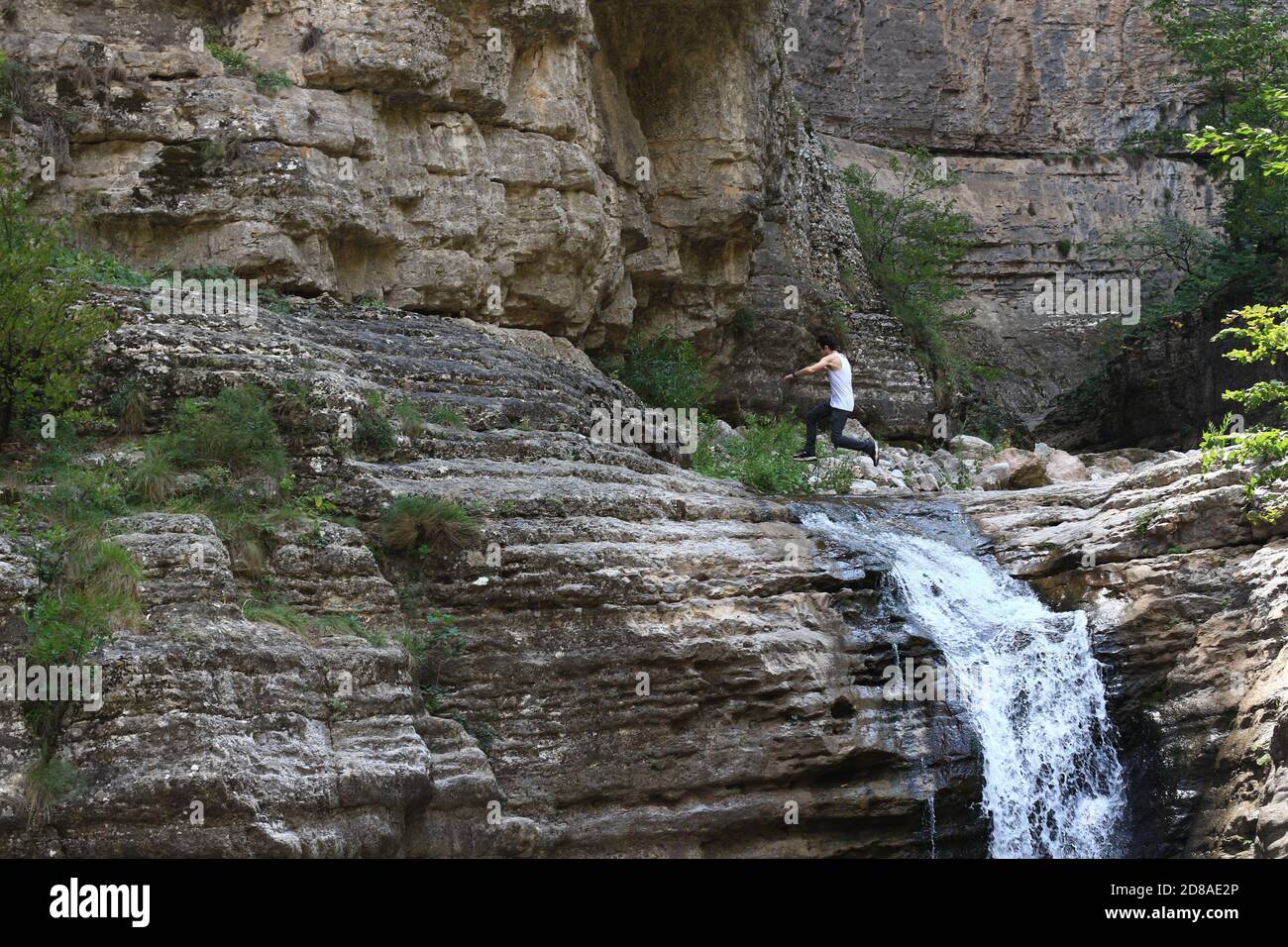Athletic young man and waterfall hi-res stock photography and images ...