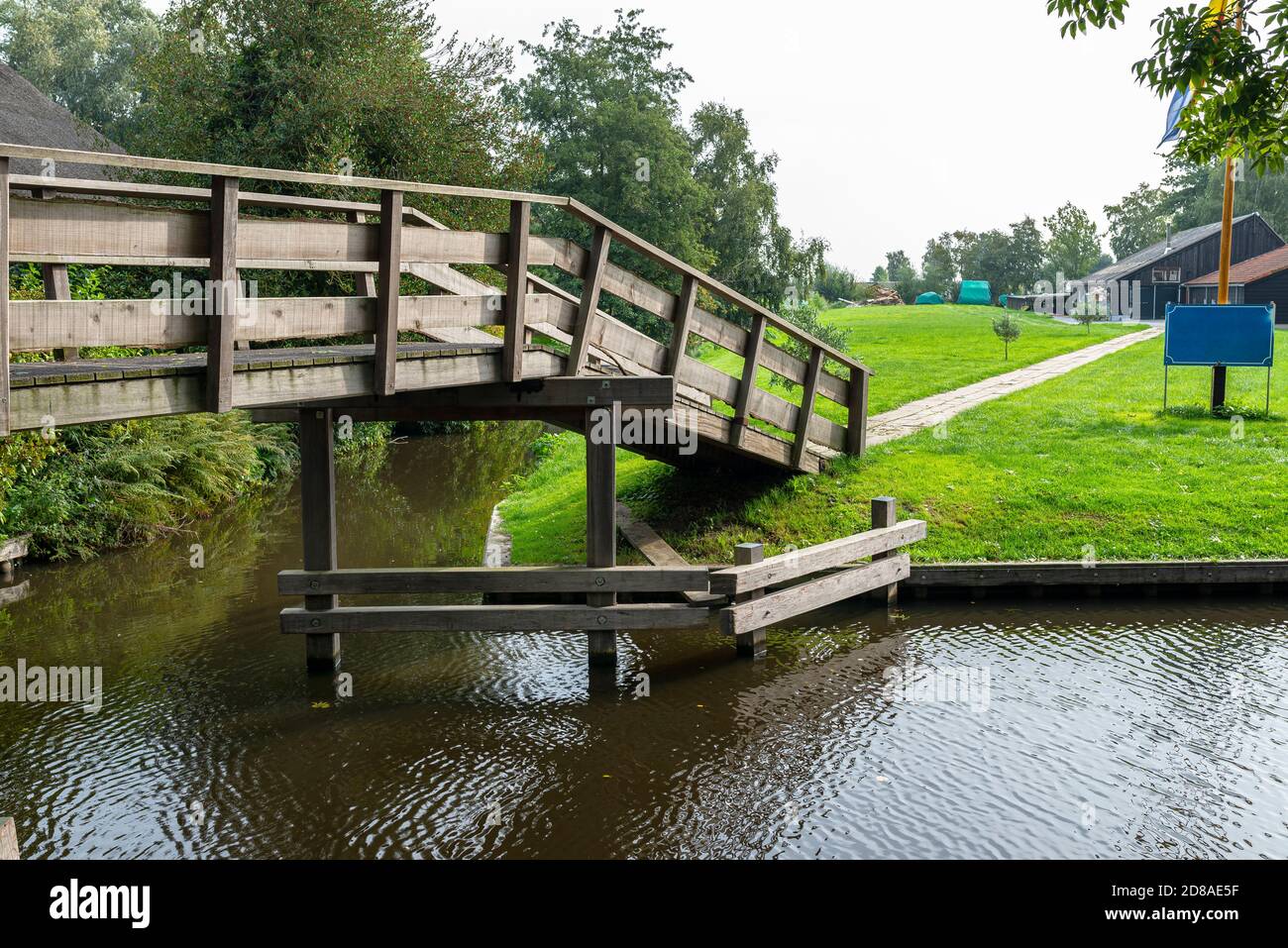 Wooden decorative footbridge over a canal in the Netherlands in the ...