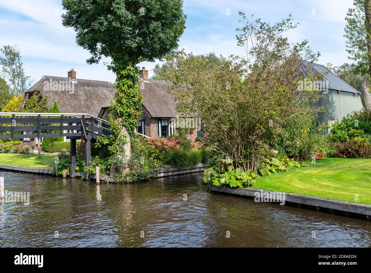 Wooden decorative footbridge over a canal in the Netherlands in the ...