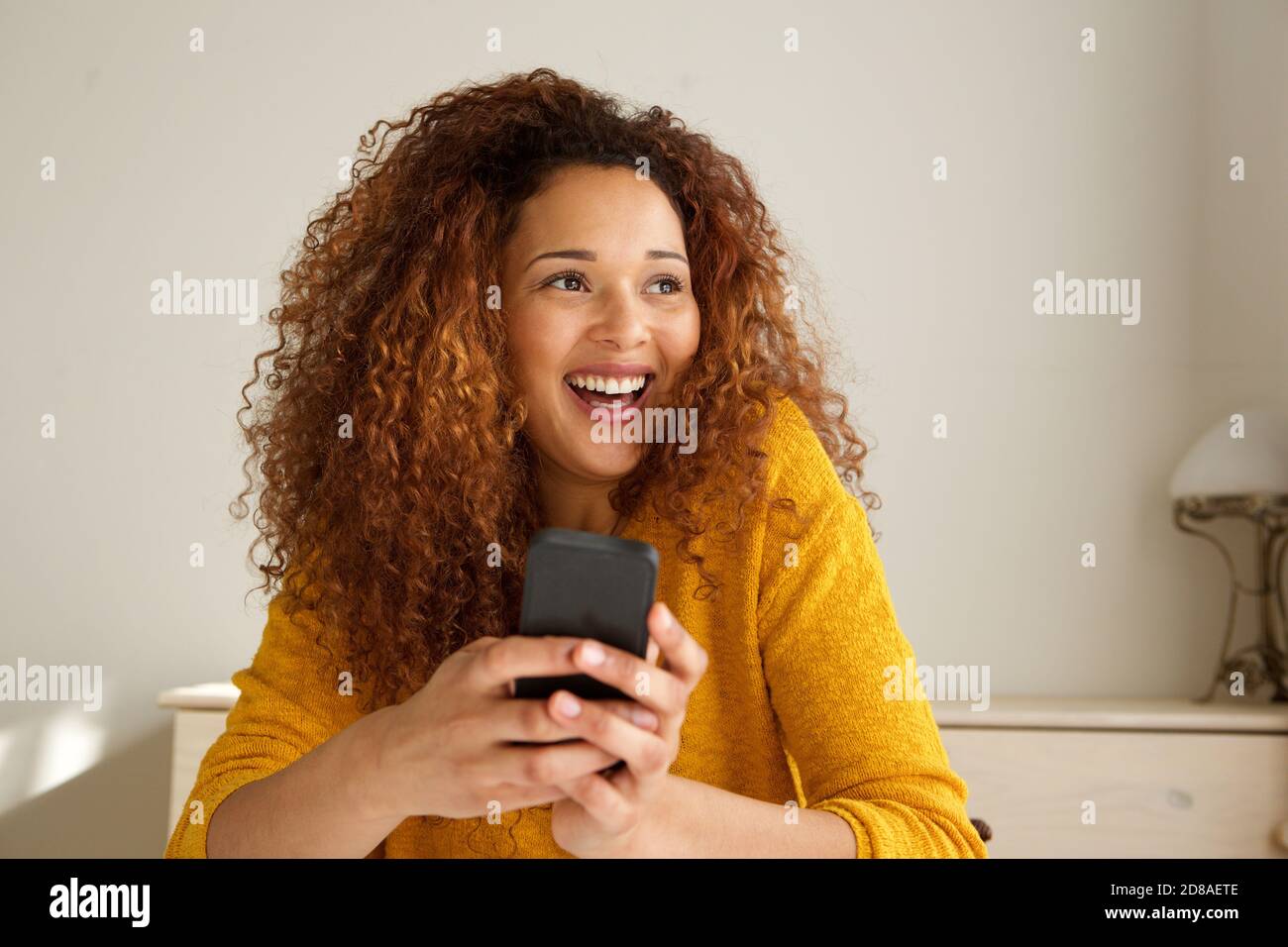 Woman telephone happy laughing home hi-res stock photography and images ...