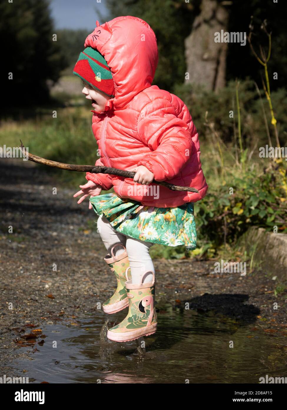 happy toddler jumping in puddles, UK Stock Photo - Alamy