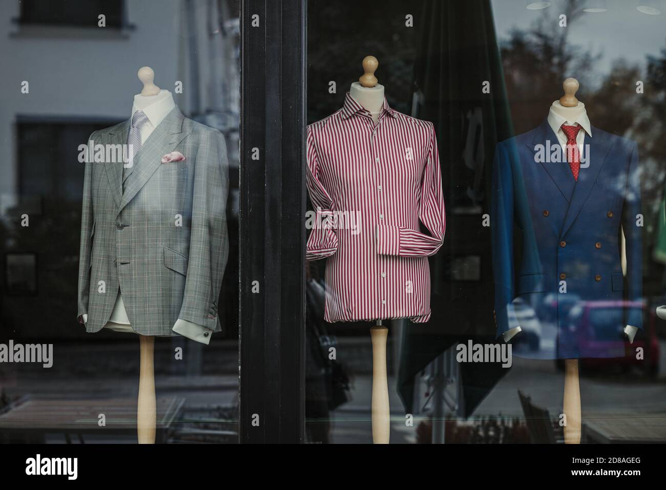 Elegant tailor made suits in a shop window Stock Photo - Alamy