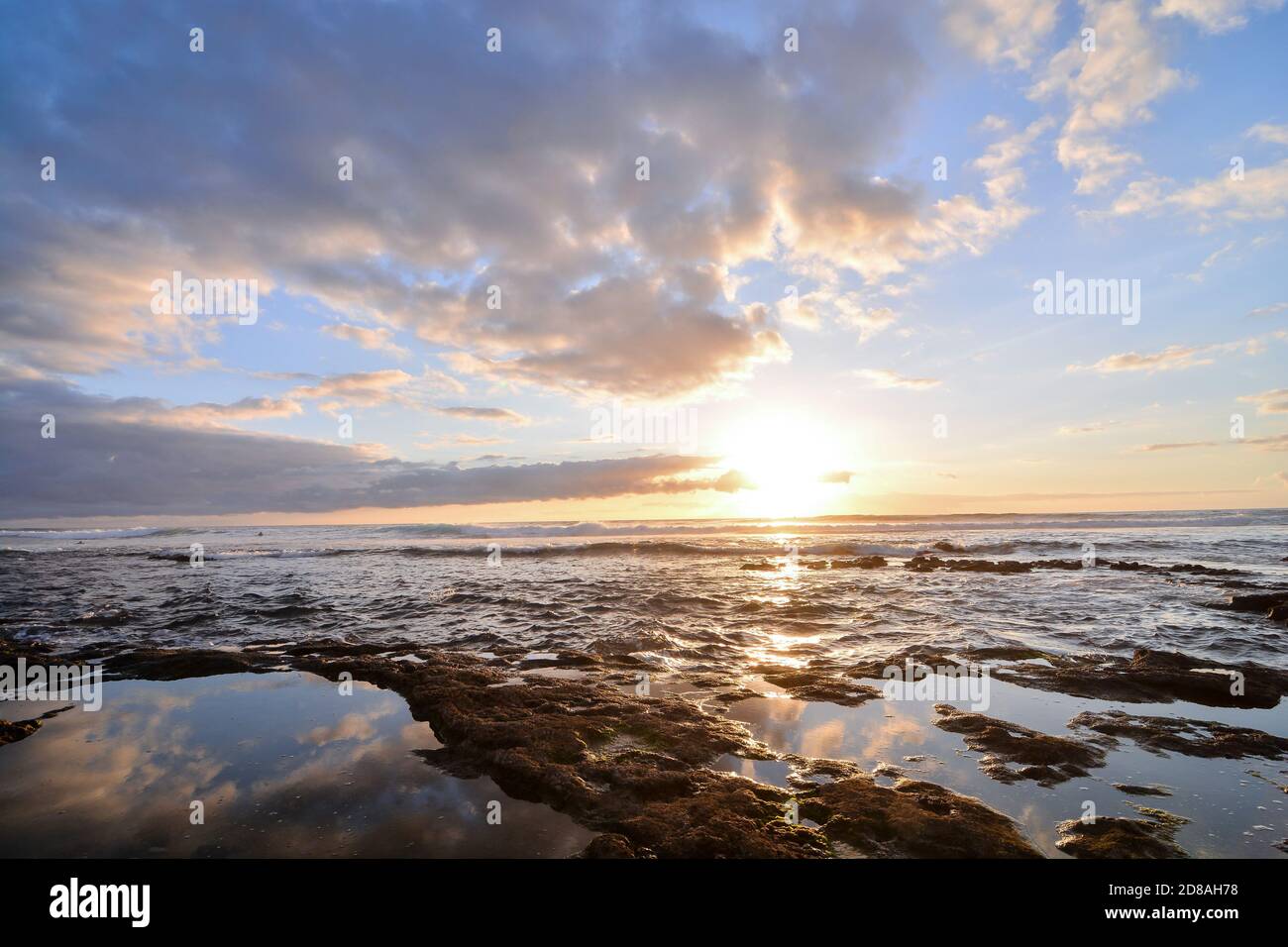 The Sun Setting in the Sea Stock Photo - Alamy