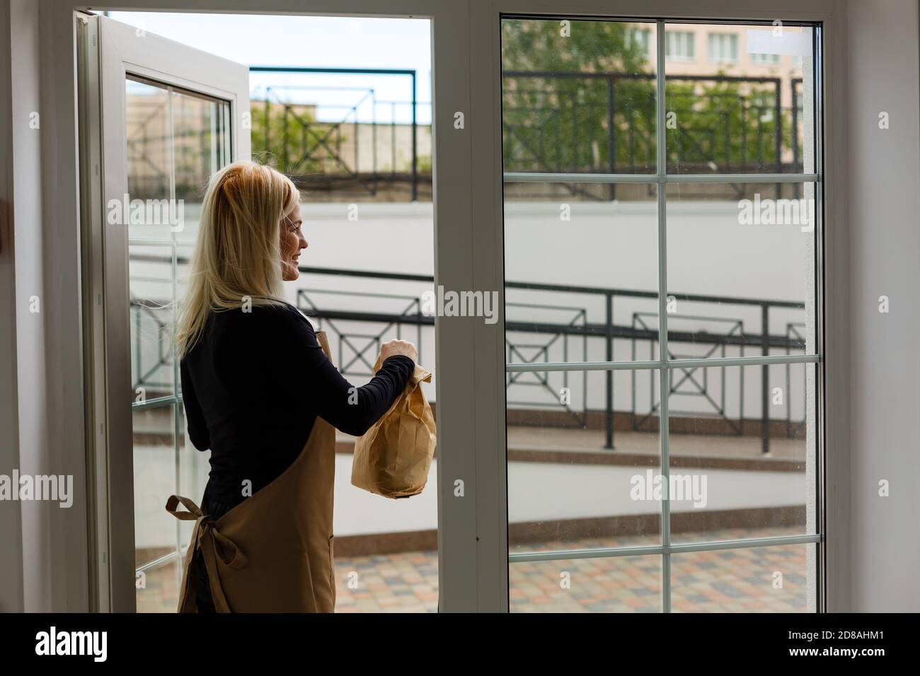 Female grocer wearing apron hi-res stock photography and images - Alamy