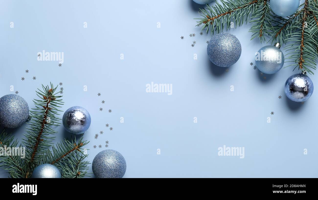 Blue Christmas background with pine tree branches decorated balls on ...