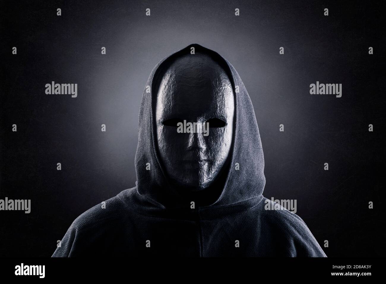 Portrait of a scary figure in hooded cloak Stock Photo - Alamy