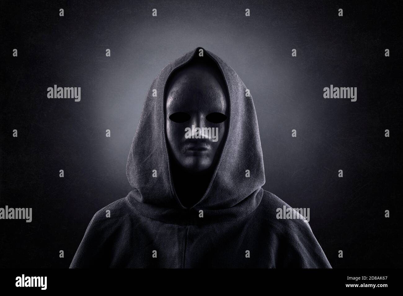 Portrait of a scary figure in hooded cloak Stock Photo - Alamy