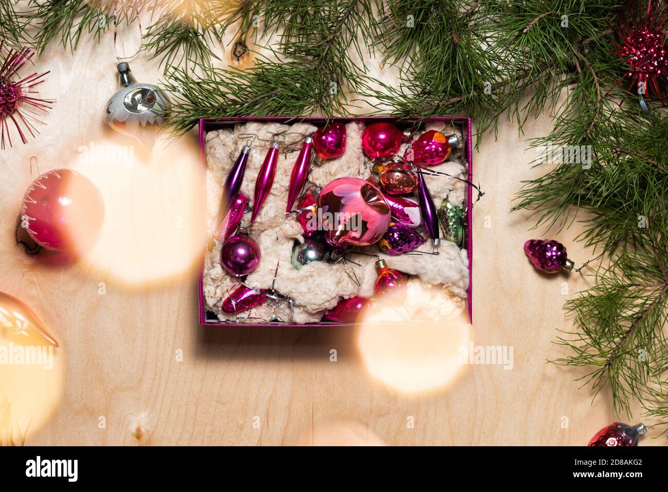 Box of old vintage Christmas tree ornaments and pine tree Stock Photo ...
