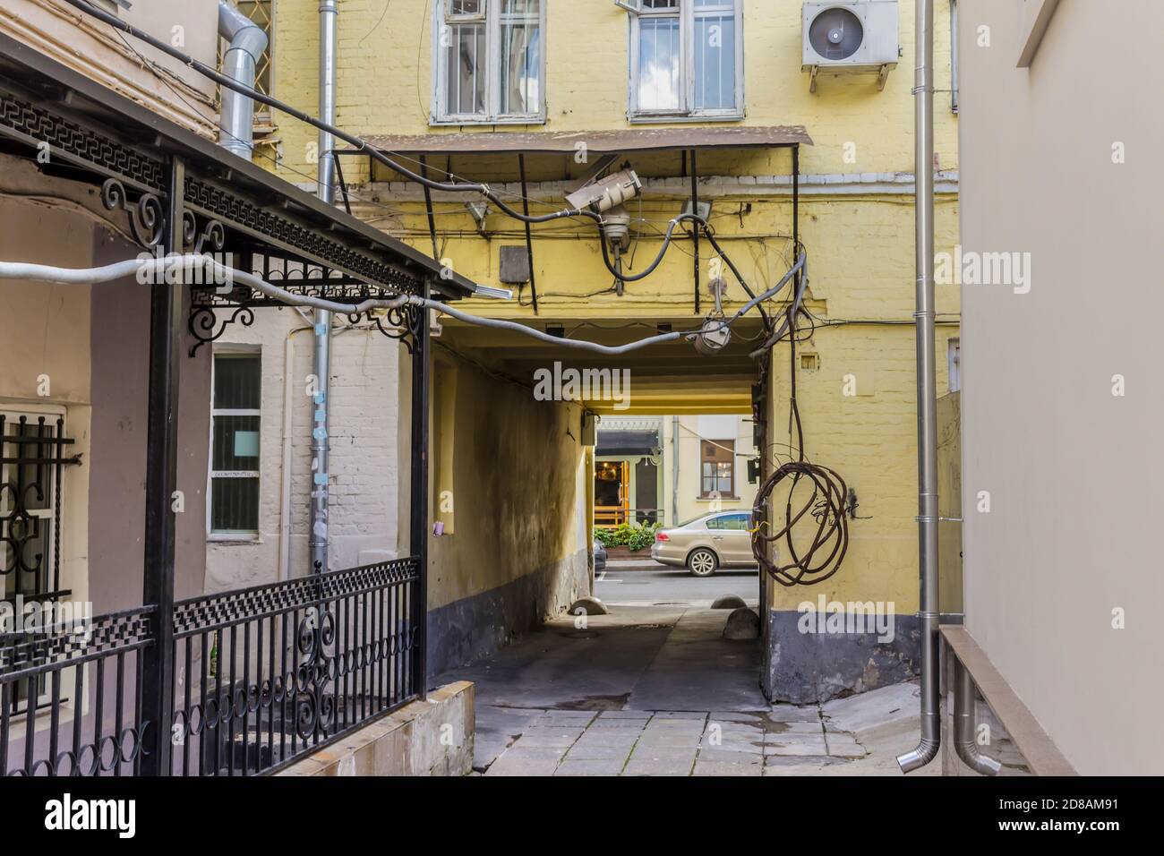 An air conditioner and a surveillance camera located above the driveway ...