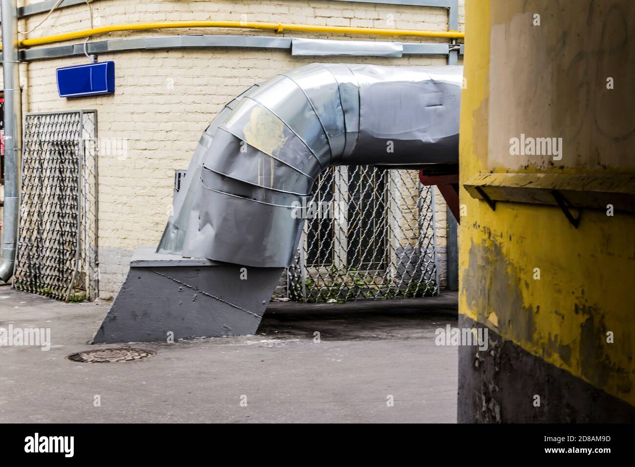 Large exhaust duct from the basement of the house. A modern urban ...