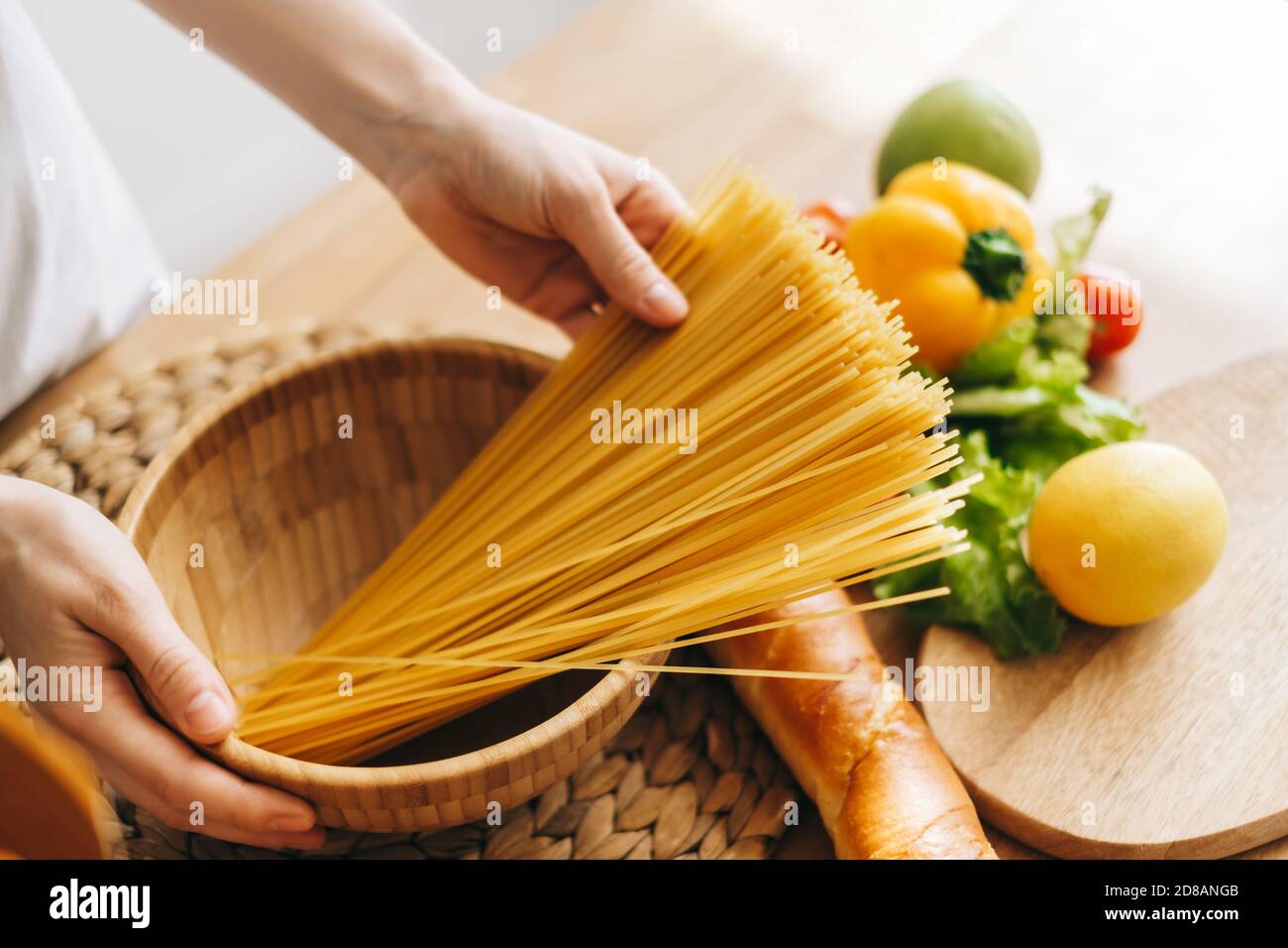 Woman holding raw spaghetti hi-res stock photography and images - Alamy