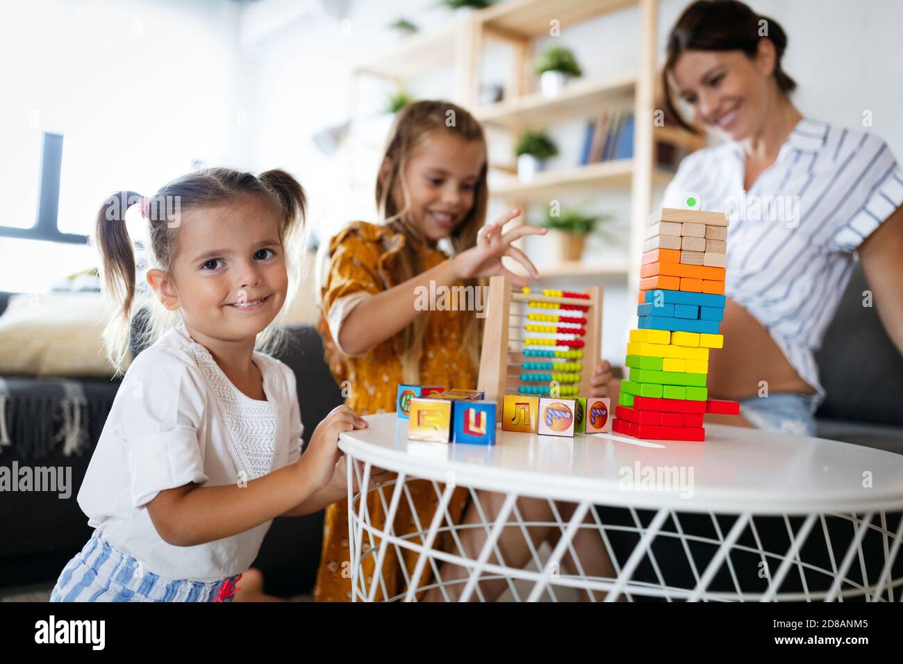 Happy family having fun times at home Stock Photo - Alamy