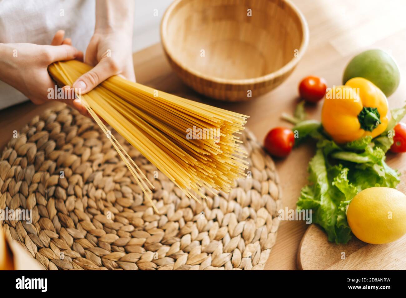 Female chief cook holding pasta hi-res stock photography and images - Alamy
