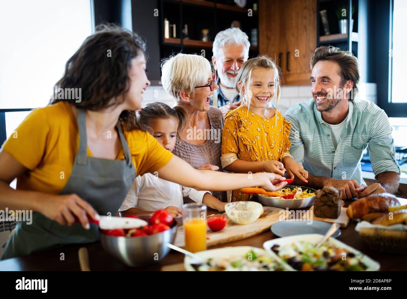 Happy family spending quality time together in the kichen Stock Photo - Alamy