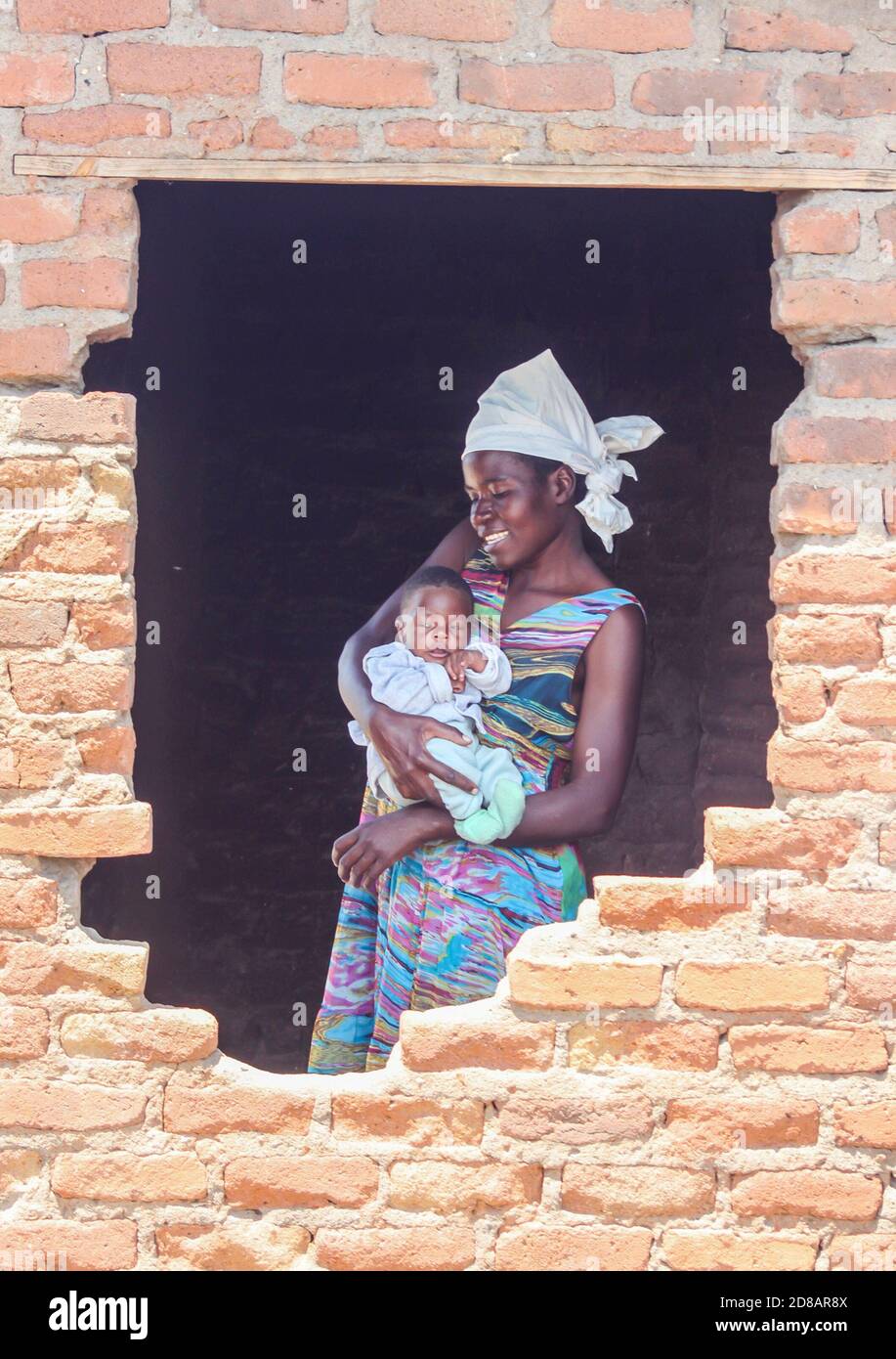 A women plays with her baby in Epworth Harare. Epworth area is one of ...
